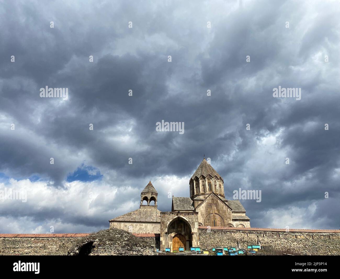A daytime view of Gandzasar monastery on a cloudy day in Artsakh ...