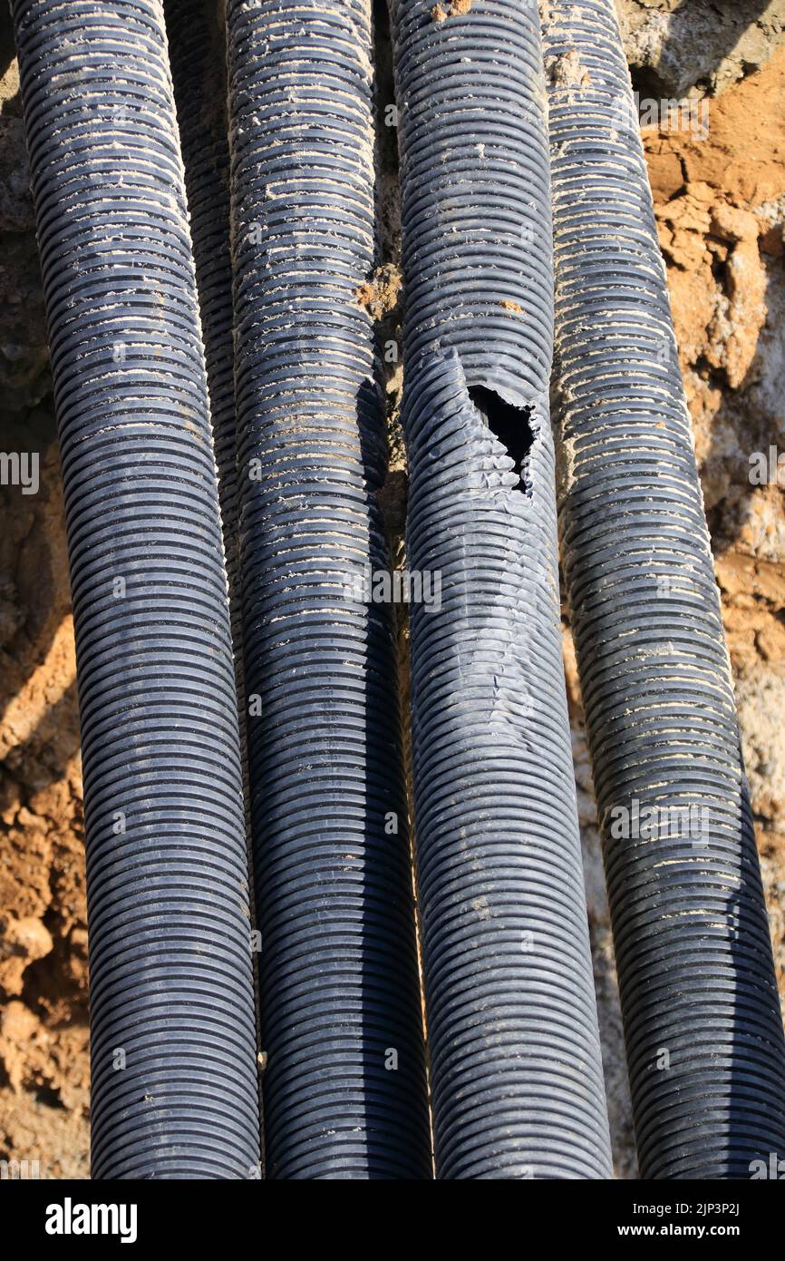 empty pipe for cables in a ditch was damaged during work Stock Photo ...