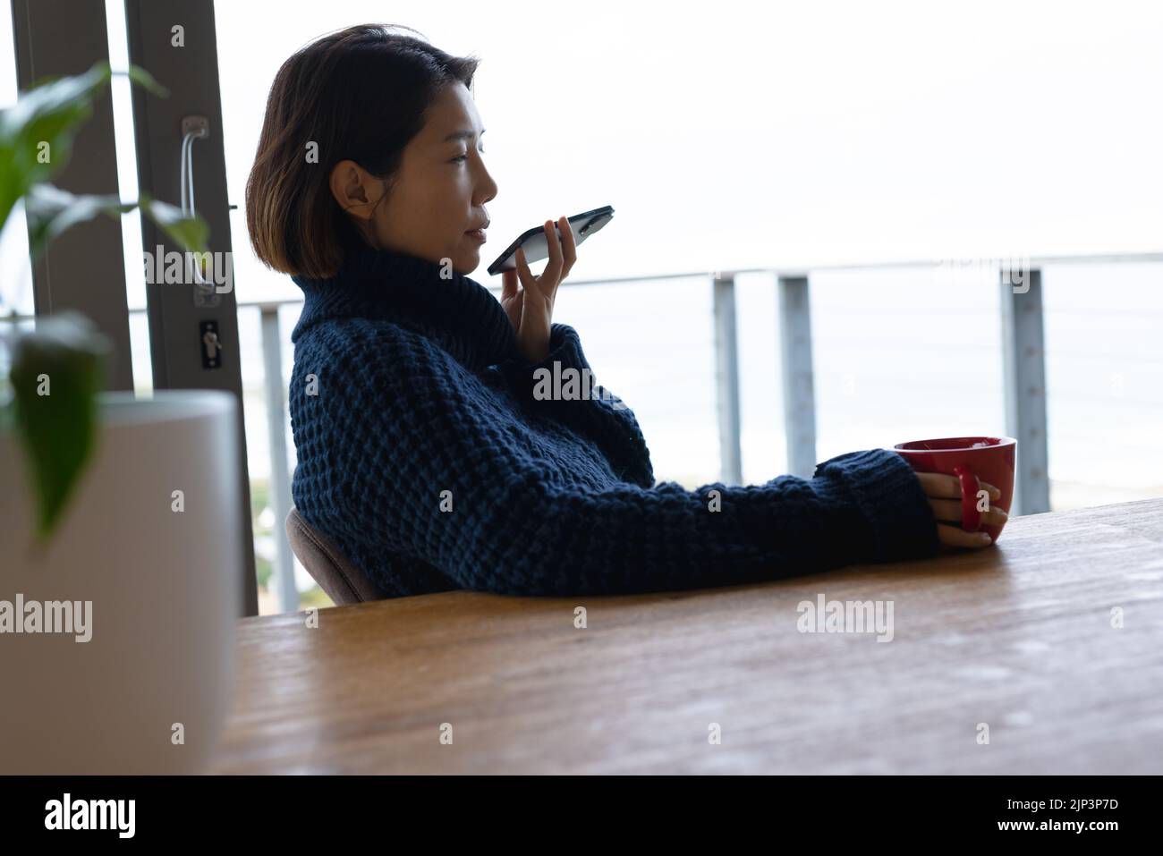 Person at table talking hi-res stock photography and images - Alamy