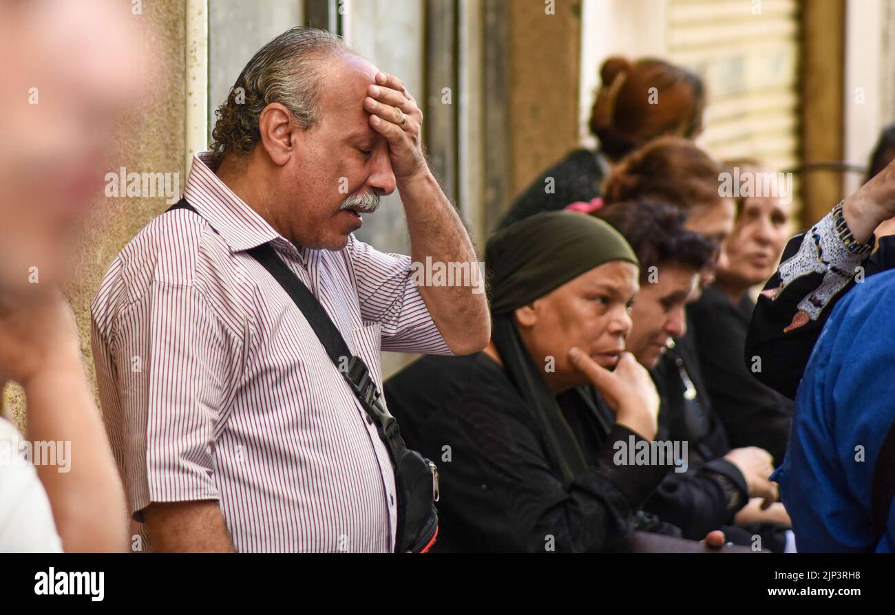 Cairo, Egypt. 15th Aug, 2022. People react during the funeral of ...