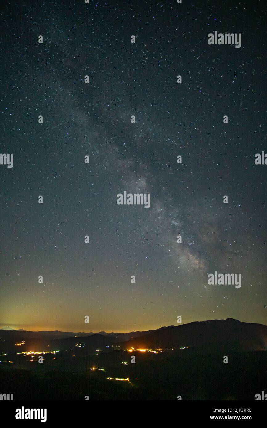 A vertical shot of the Milky Way glowing in a night sky Stock Photo - Alamy