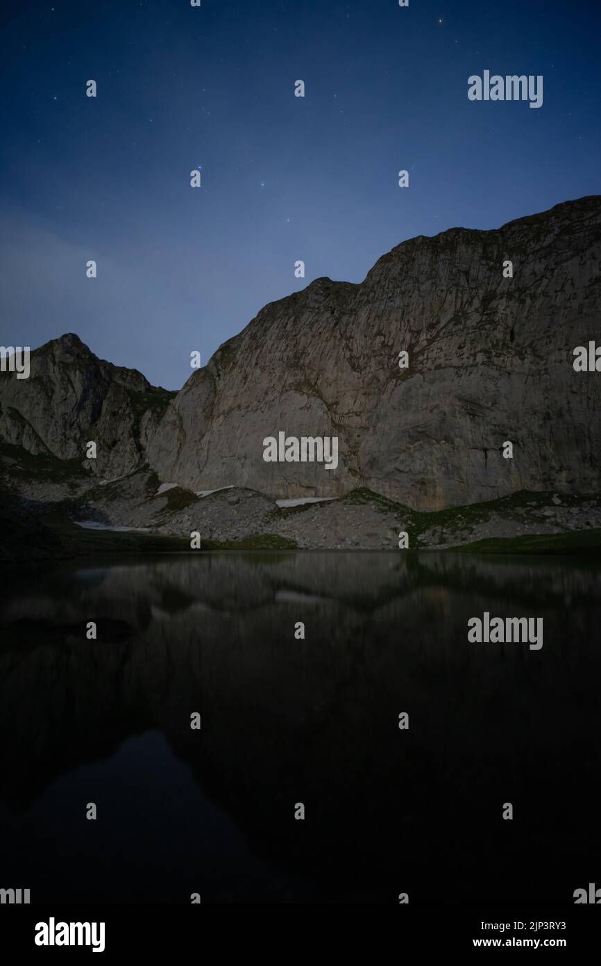 The Avostanis Lake in Italy Friuli-Venezia Giulia, at night with starry ...