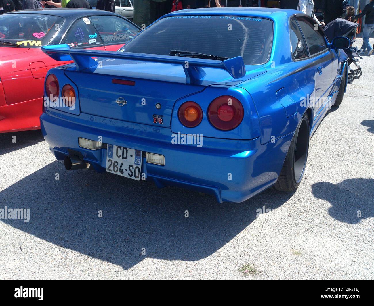 A blue Nissan Skyline GT-R parked outside Stock Photo - Alamy