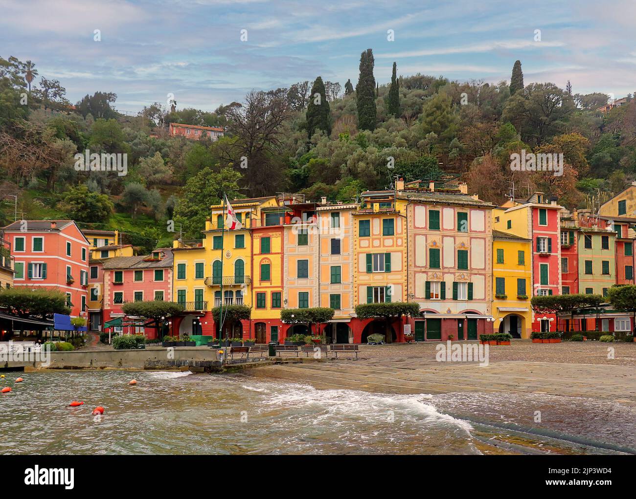 Old colorful facades houses in Portofino coast with trees and sky in ...