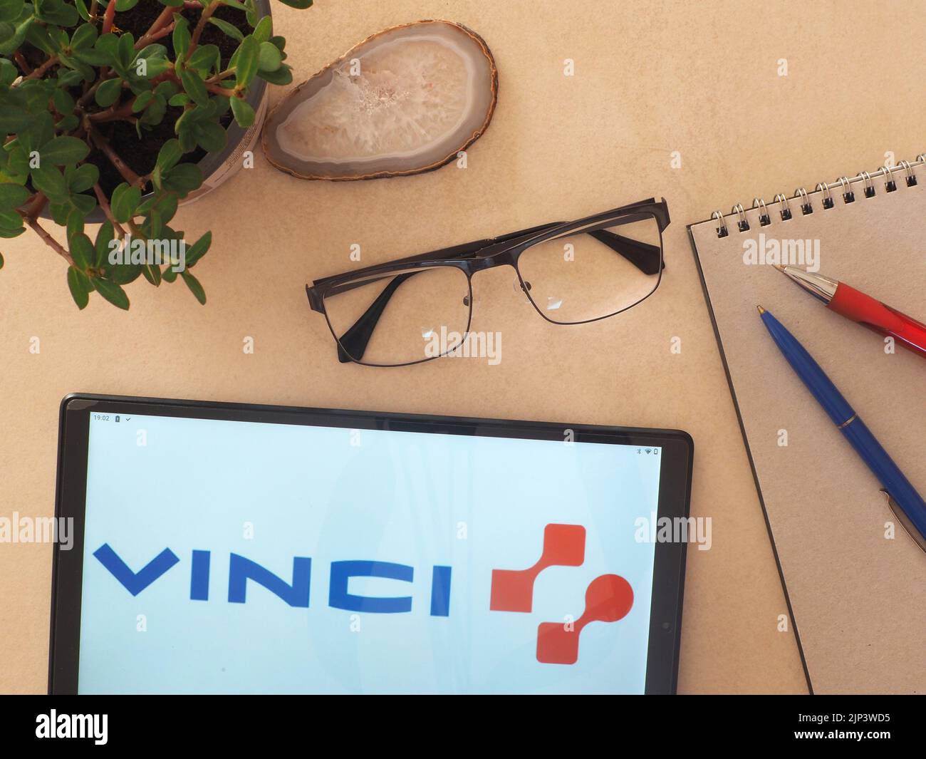 In this photo illustration, Vinci S.A. logo seen displayed on a tablet ...