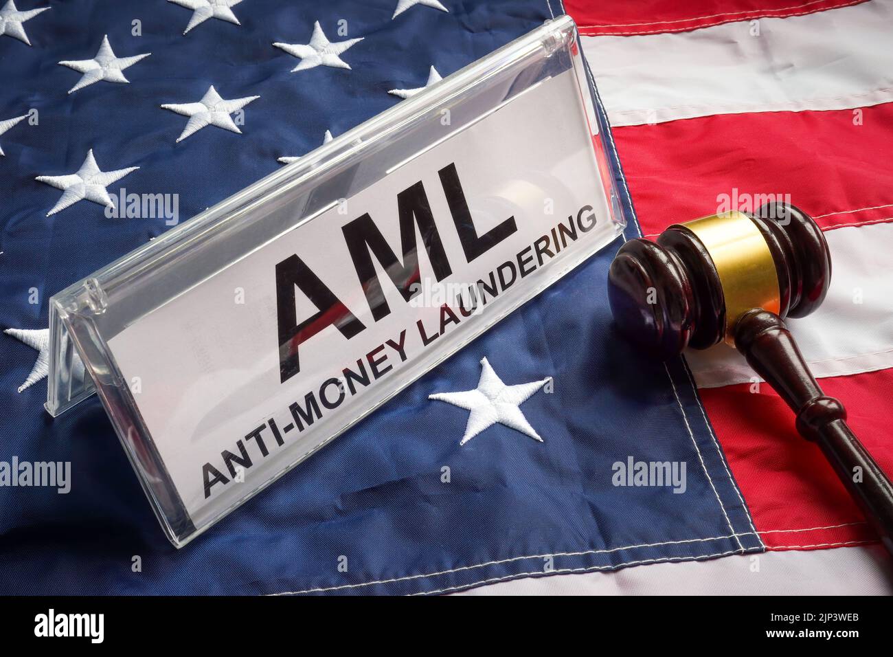 Plate with Anti Money Laundering AML, gavel and flag Stock Photo - Alamy