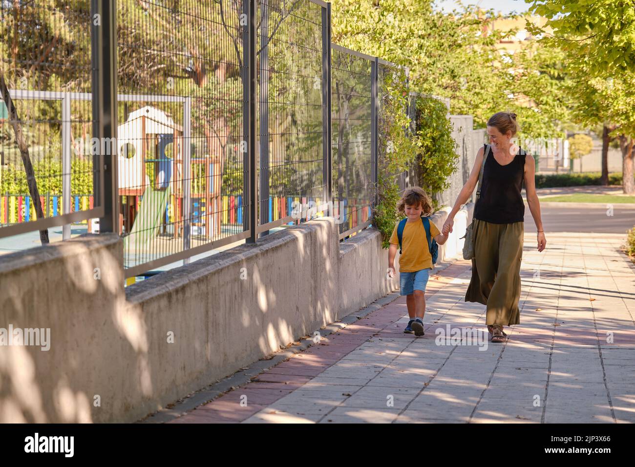 Happy mother and son going to school Stock Photo - Alamy