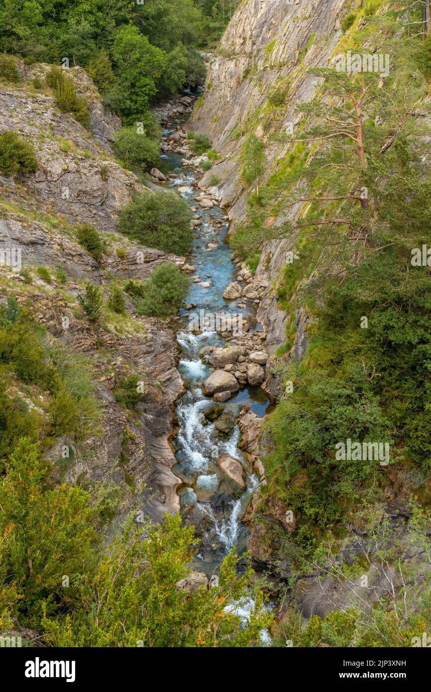 A vertical shot of a river between cliffs Stock Photo - Alamy