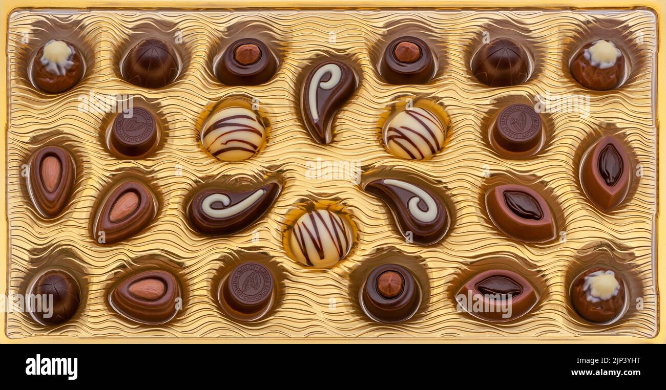 chocolate candies in the box, top view Stock Photo - Alamy