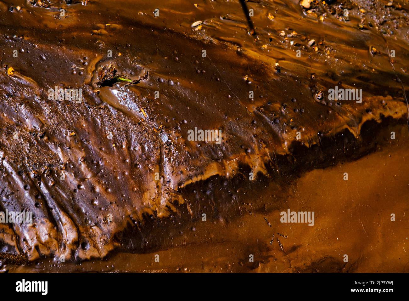colored mud river, close view Stock Photo - Alamy