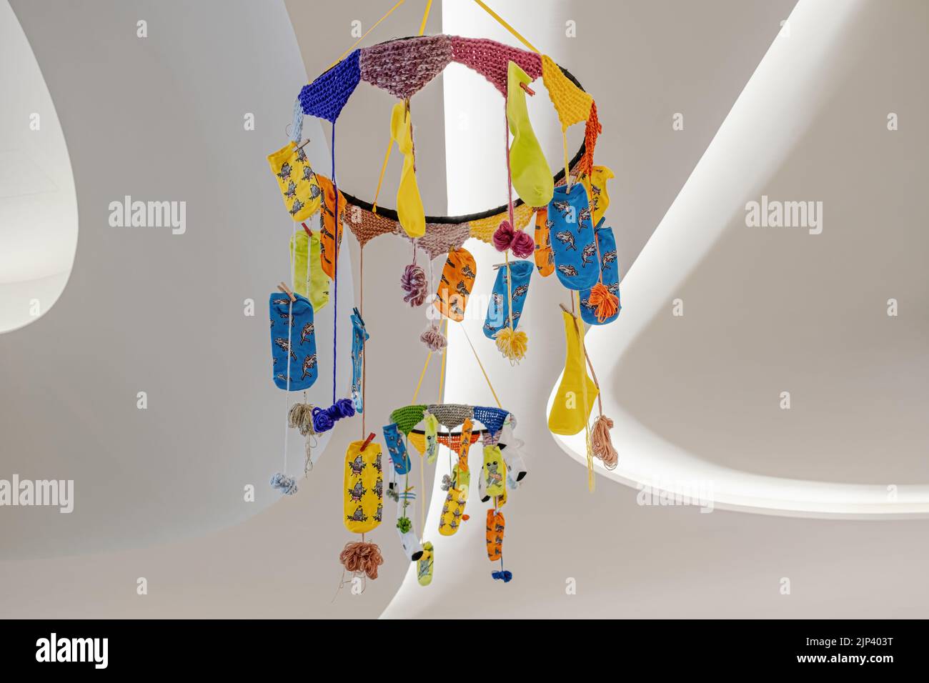 Different Multicolored Socks Hang at White Ceiling with Lights Stock ...