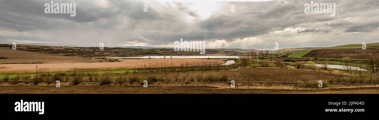 cultivated fields and rain clouds, Mandra village, Sibiu, Romania Stock ...
