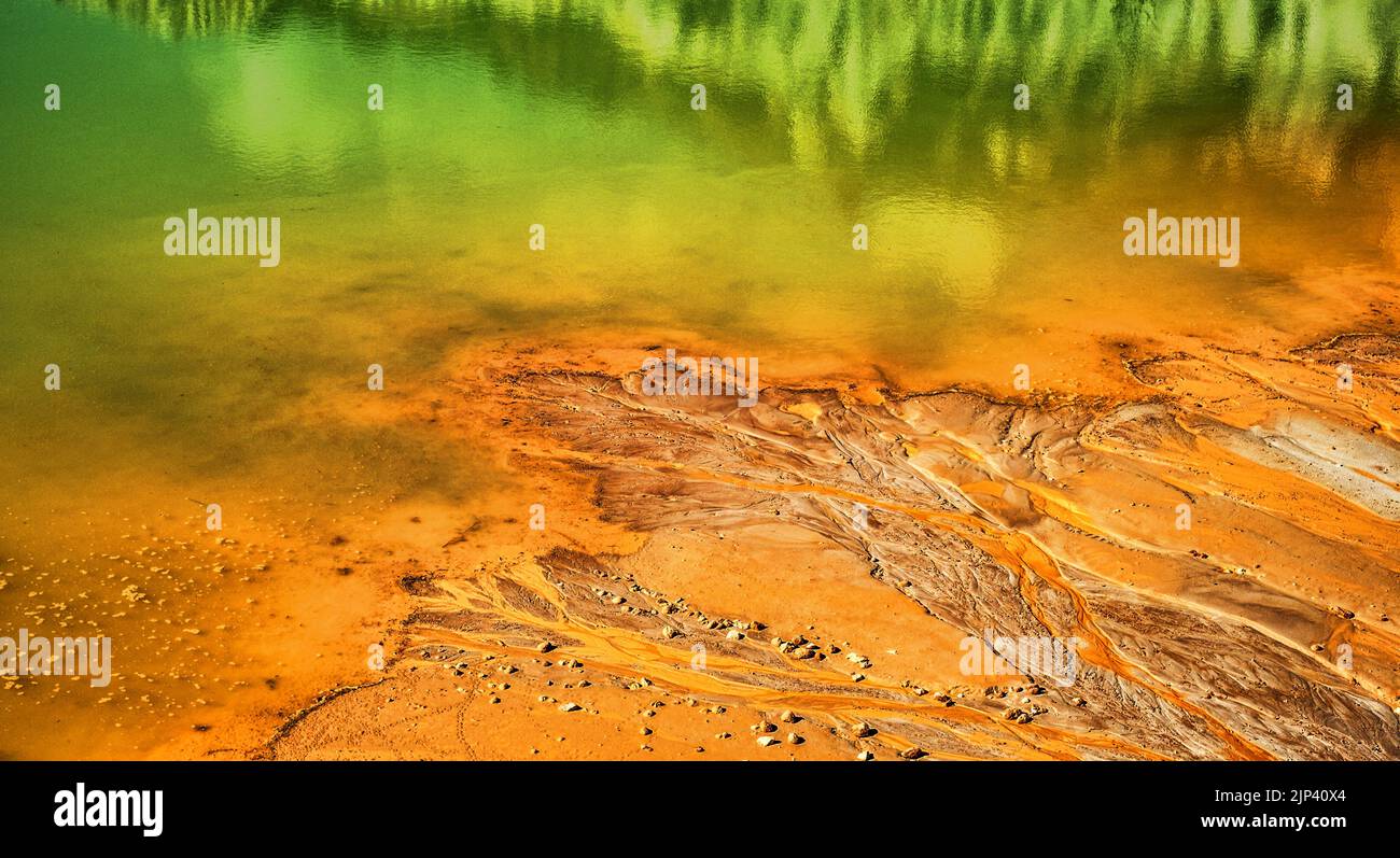 the edge of the lake polluted with toxic mining chemical residuals ...