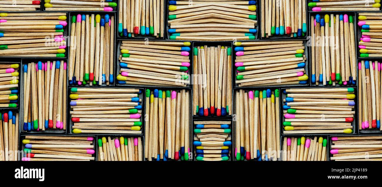 multicolored match sticks in boxes on a black background Stock Photo ...
