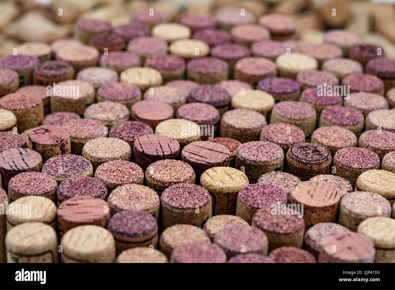 Old Used corks plugs from various types of wine on dark background ...