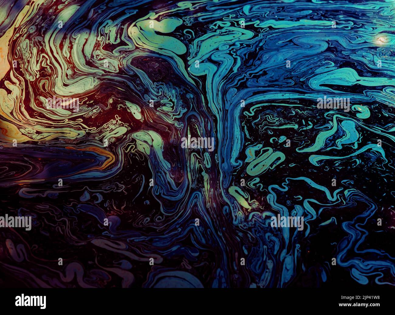 Rainbow colors created by diesel fuel floating on the water Stock Photo ...