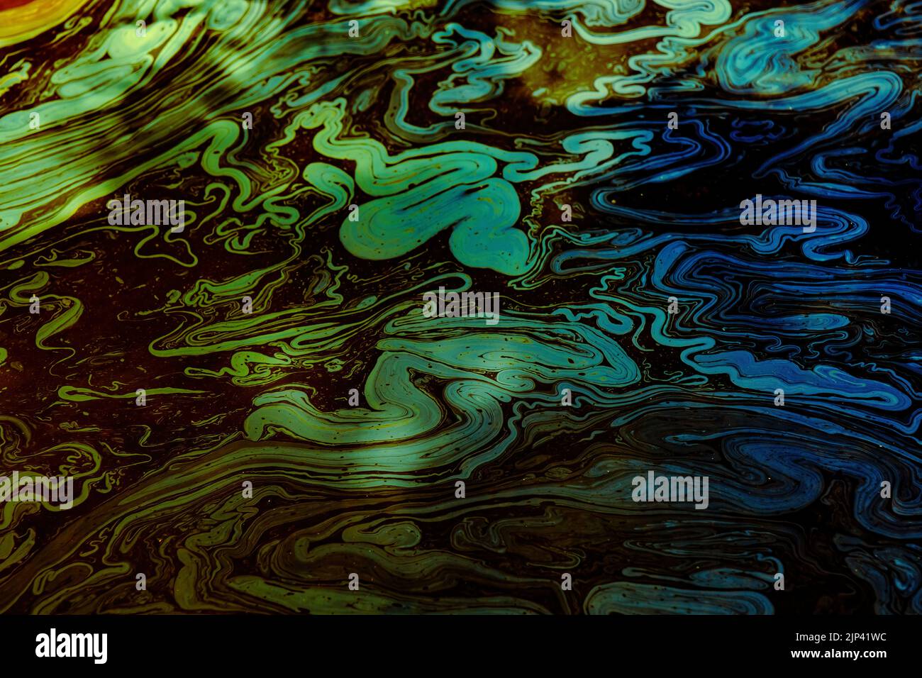 Rainbow colors created by diesel fuel floating on the water Stock Photo ...