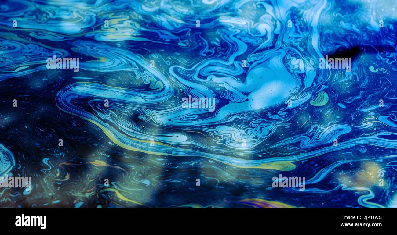 Rainbow colors created by diesel fuel floating on the water Stock Photo ...