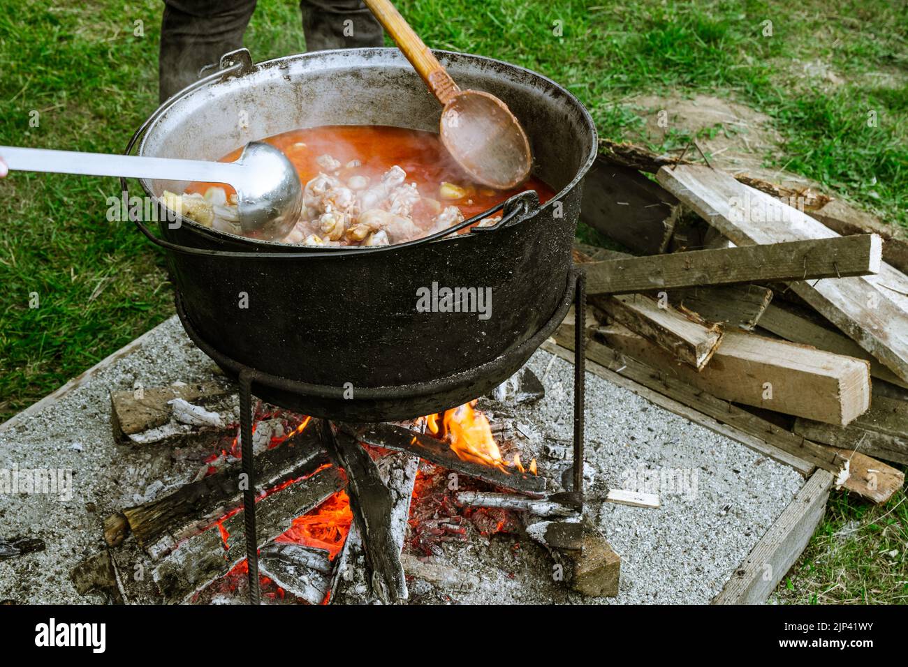 Romanian traditional food prepared at the cauldron on the open fire ...