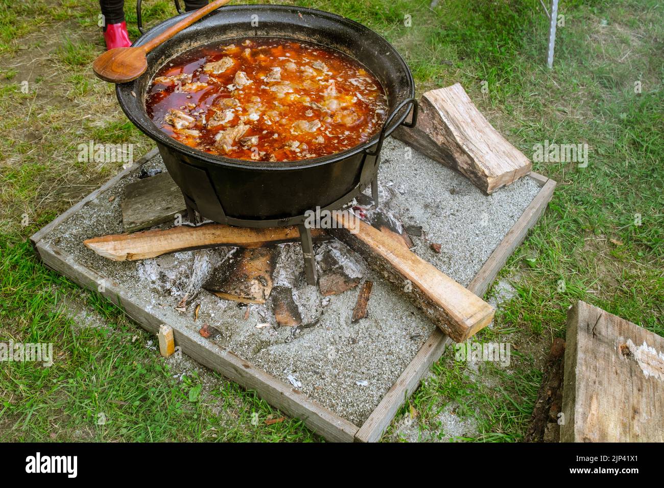 Romanian traditional food prepared at the cauldron on the open fire ...