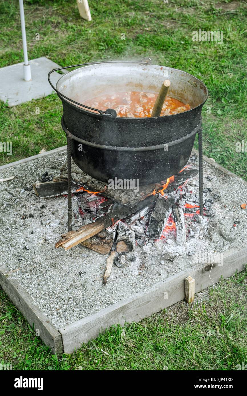 Romanian traditional food prepared at the cauldron on the open fire ...