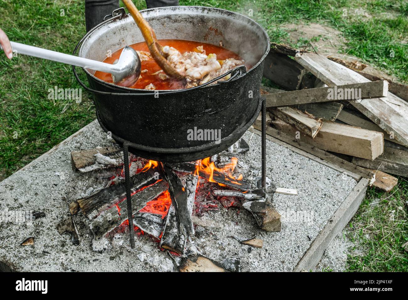 Romanian traditional food prepared at the cauldron on the open fire ...