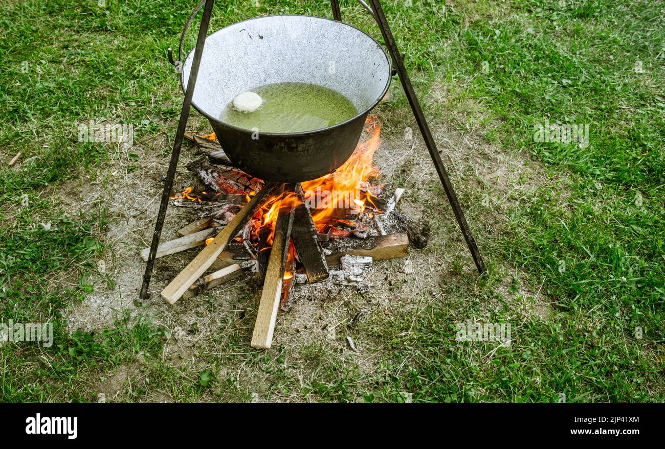 Romanian traditional food prepared at the cauldron on the open fire ...