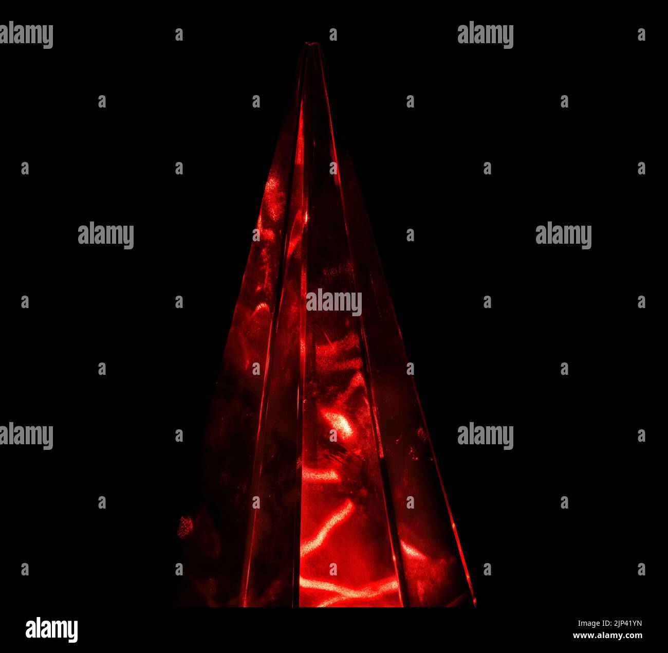 red Glass pyramid prismon black background Stock Photo - Alamy