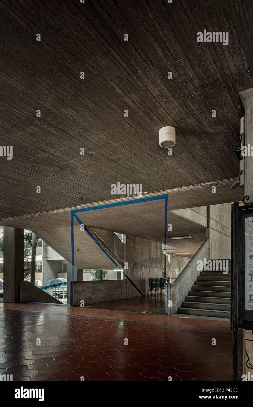 mezzanine, large empty room, brutalist architecture, with ceiling lamps ...