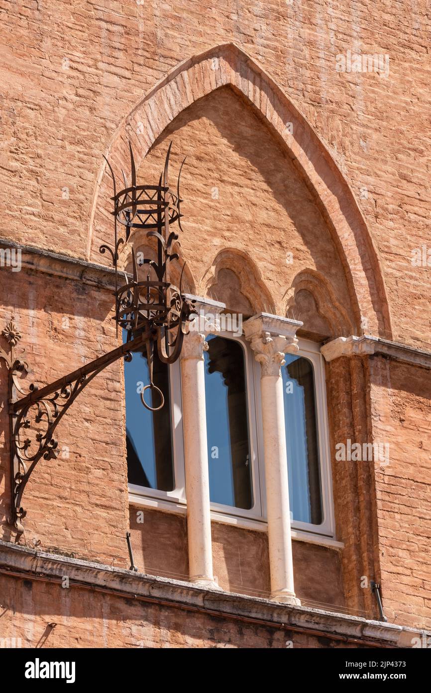 Lantern And Window On An Ancient House Facade In Siena Stock Photo - Alamy