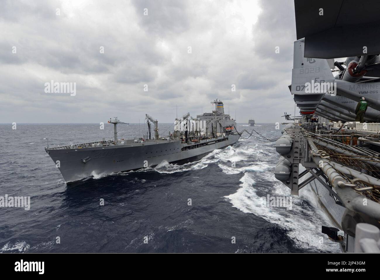 The fleet replenishment oiler USNS Rappahannock (T-AO 204), left ...