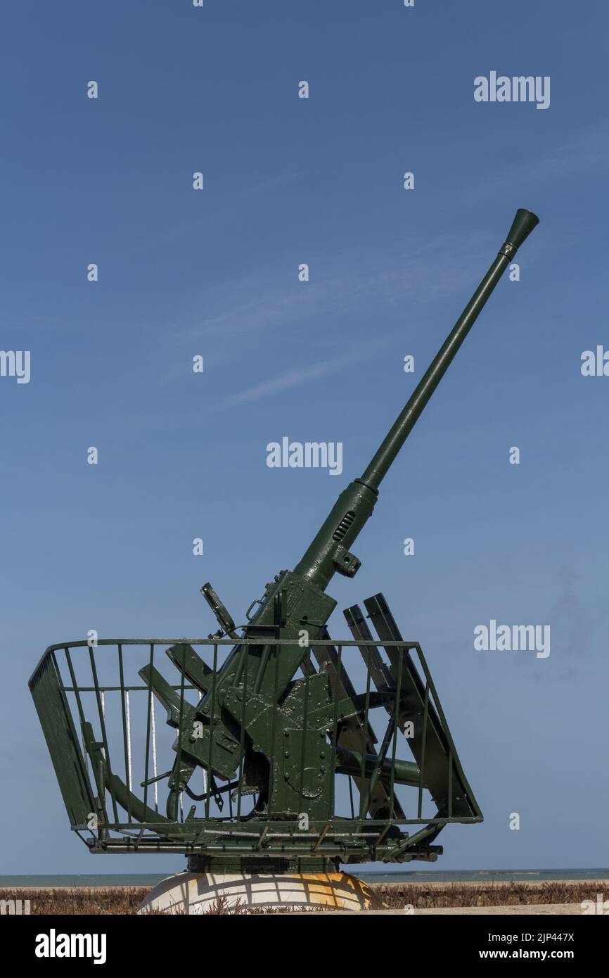 A vertical shot of a war weapon parked in a place where the Second ...