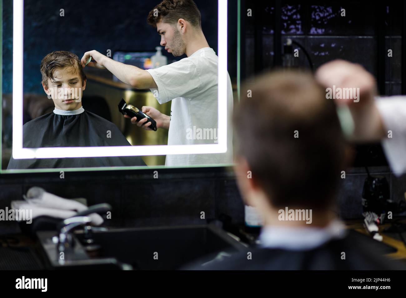 Barber barbershop haircut boy hi-res stock photography and images - Alamy