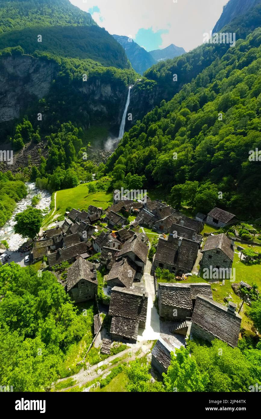 A mesmerizing view of raging waterfalls surrounded by trees Stock Photo ...