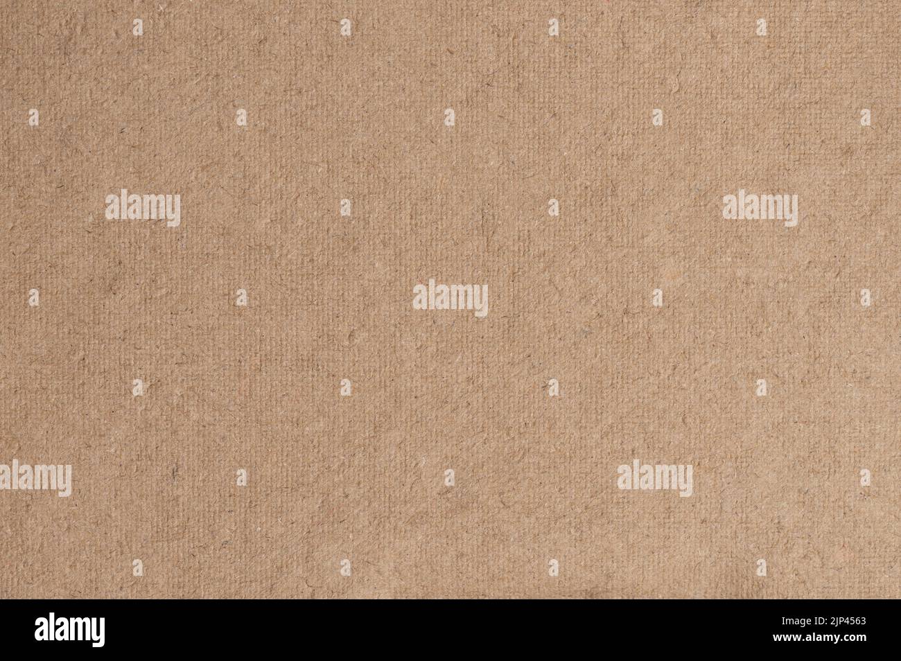 Compressed recycled paper texture surface macro close up view brown ...