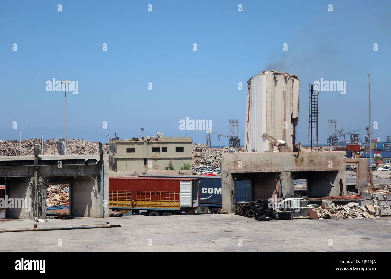 Smoke and fire come out from semi-destroyed grain silos at the port of ...