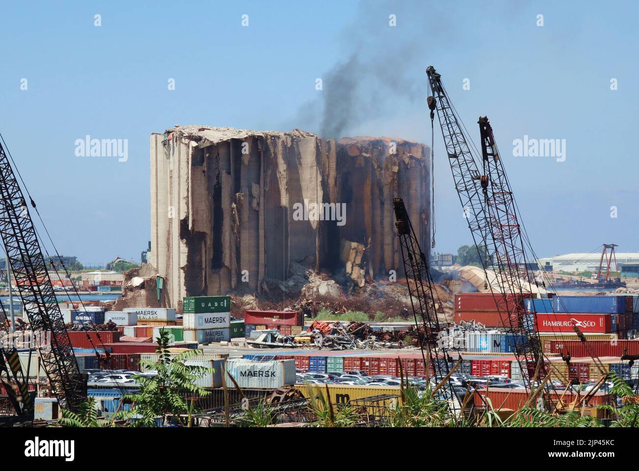 Smoke and fire come out from semi-destroyed grain silos at the port of ...