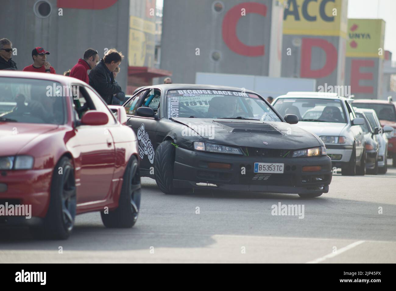 A black Nissan Silvia S14 going out from the paddock Stock Photo - Alamy