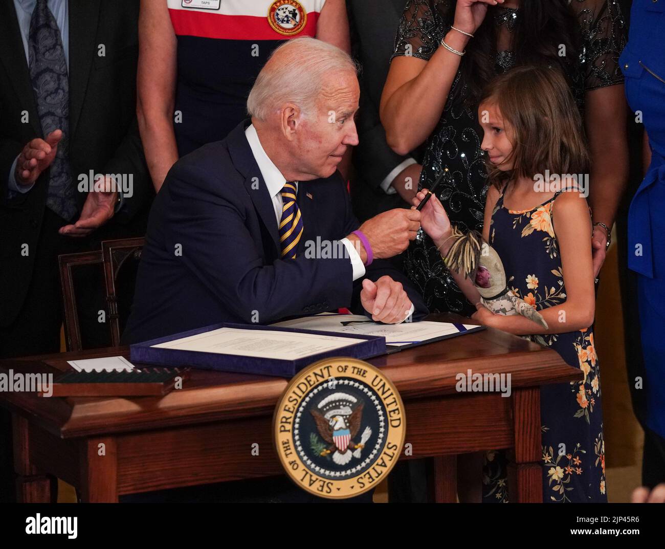 United States President Joe Biden gives the pen he used to sign the ...