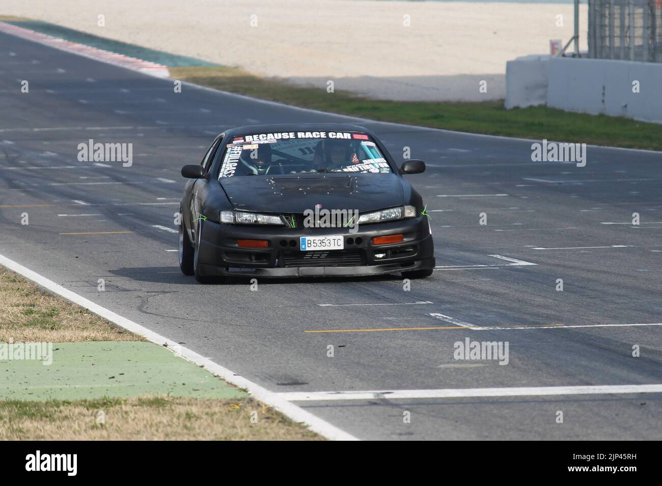 A drifting black Toyota sports tuning car on a race track Stock Photo ...