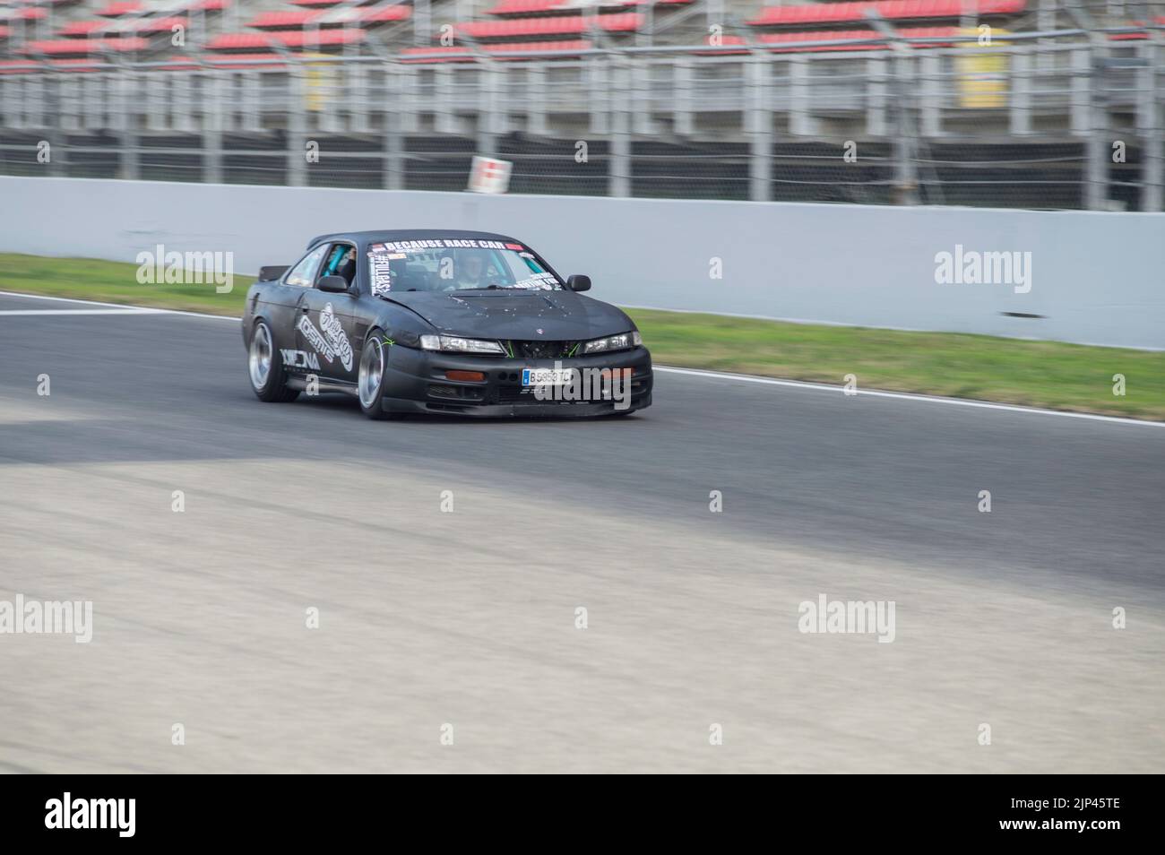 A shallow focus of a drifting black custom tuning car Stock Photo - Alamy