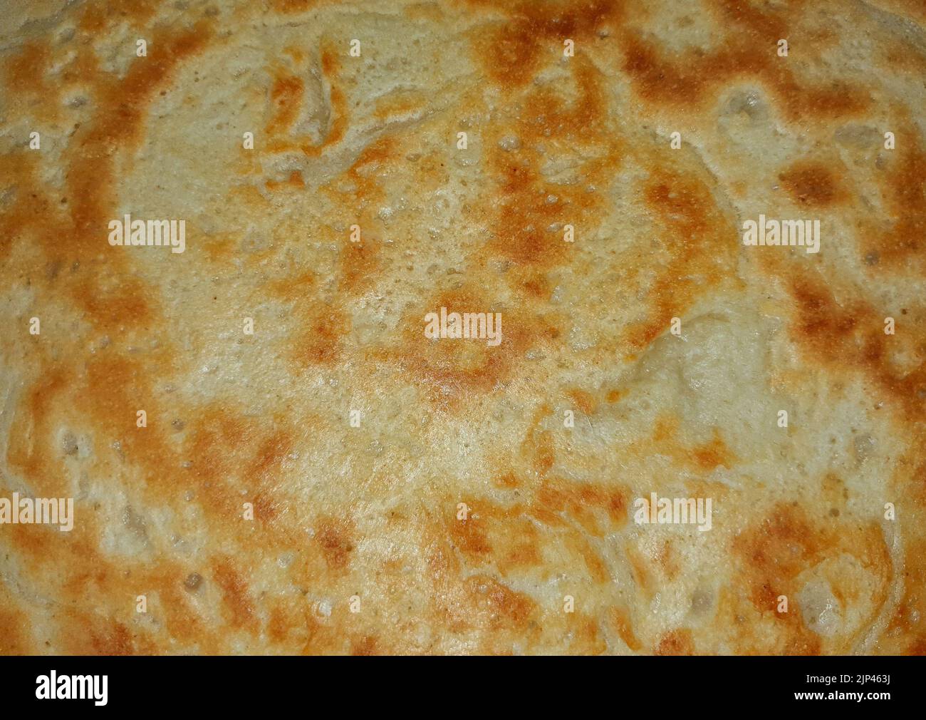a close-up with the texture of a fried pancake, surface Stock Photo - Alamy
