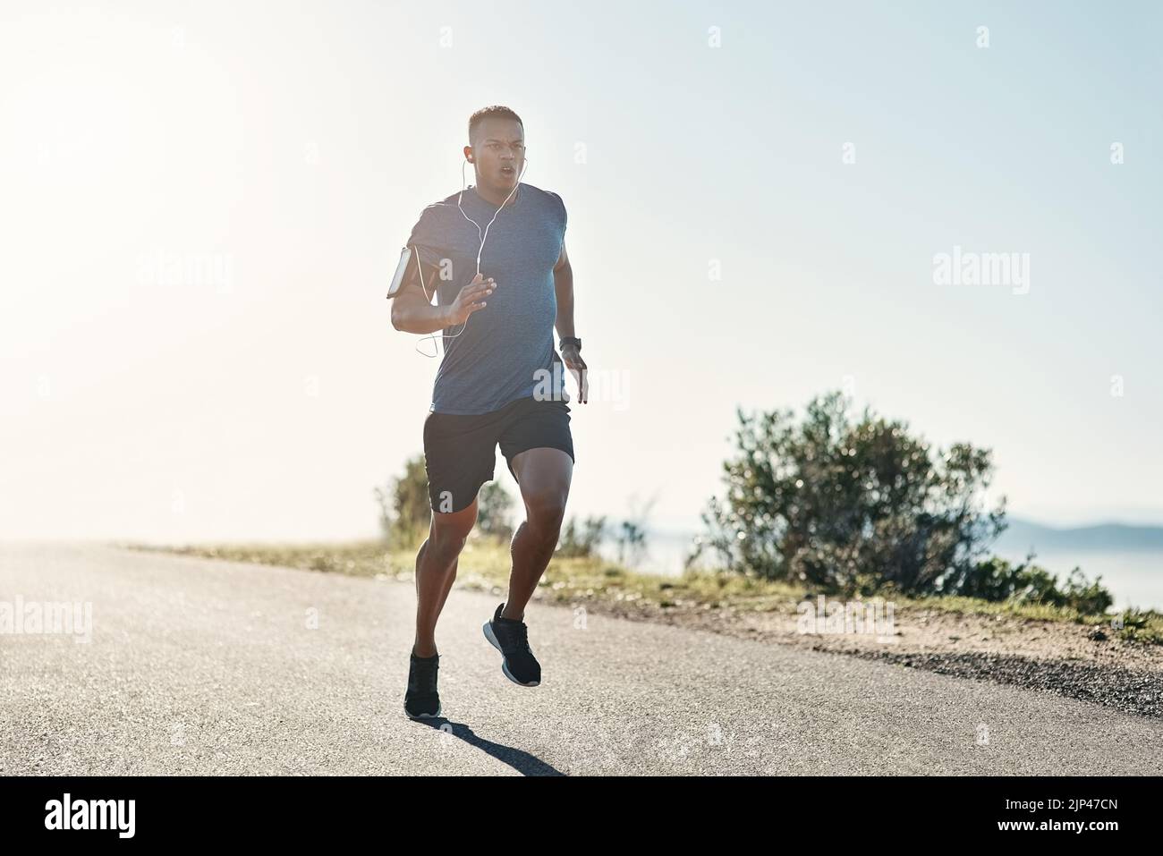 Get moving and start losing weight. a handsome young man running ...