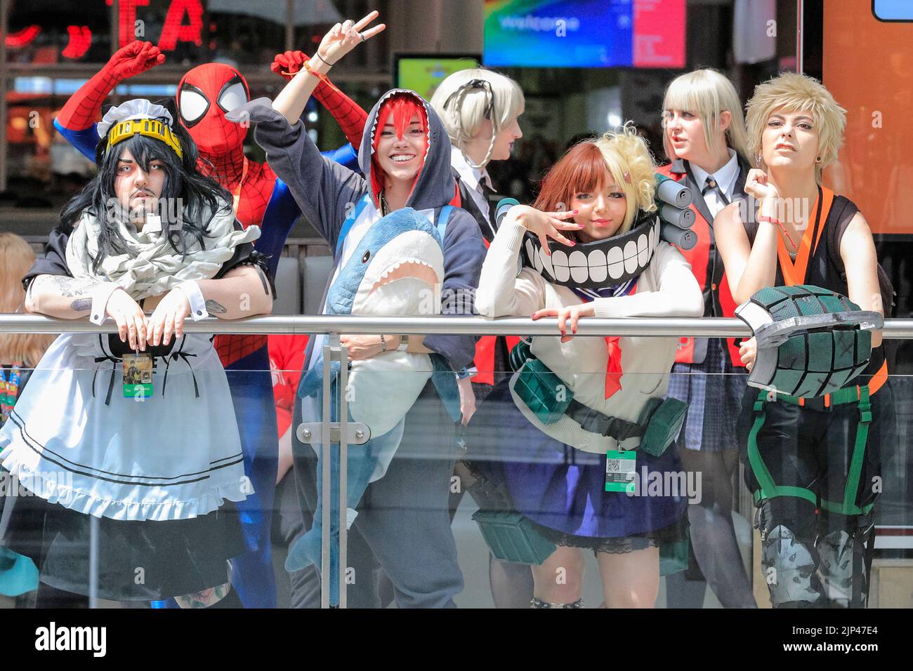 Group of cosplayers, visitors in costumes at Comic Con London, England ...