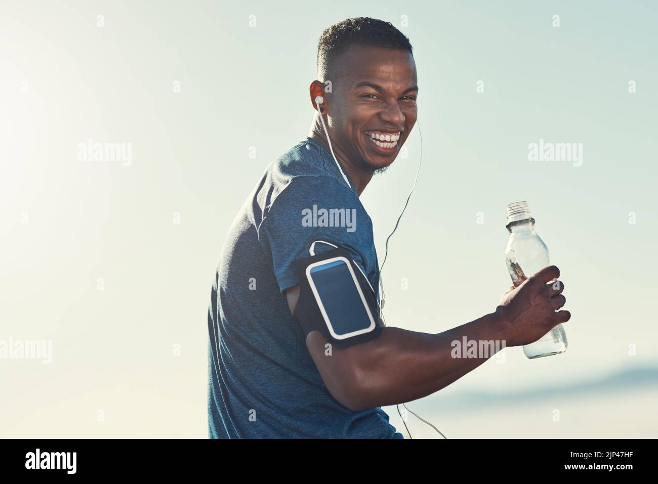 What a great refreshment during a run. a handsome young male runner ...