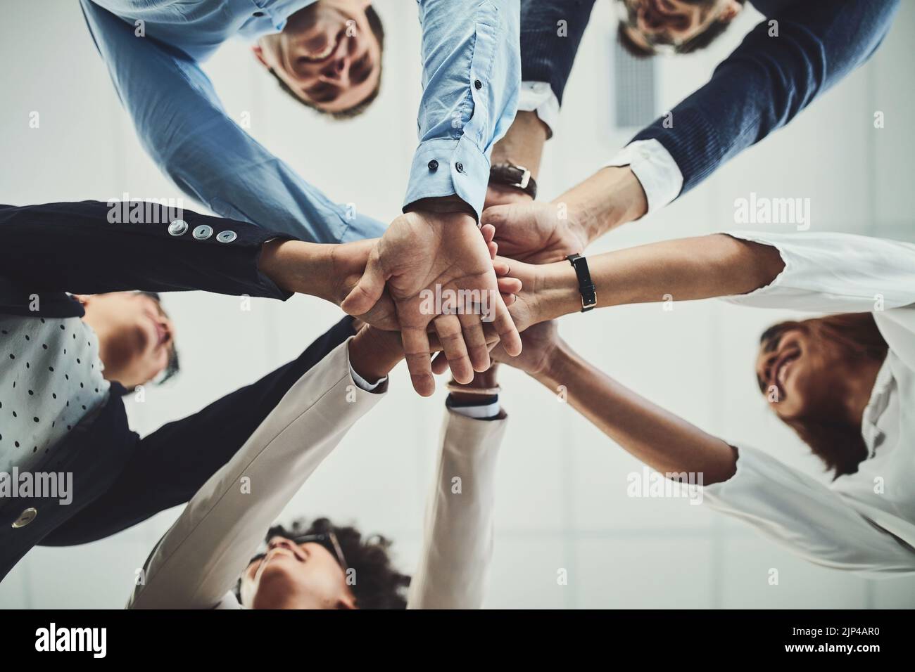 Team of business people hands stacked showing teamwork, collaboration ...