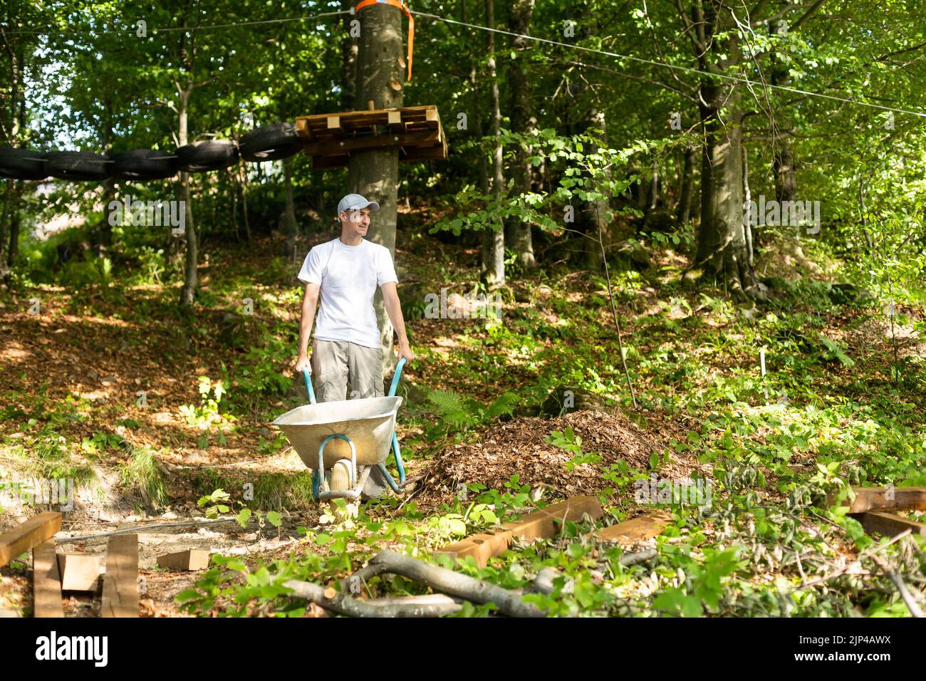 professional gardener use shovels to prepare soil on wheelbarrows for ...