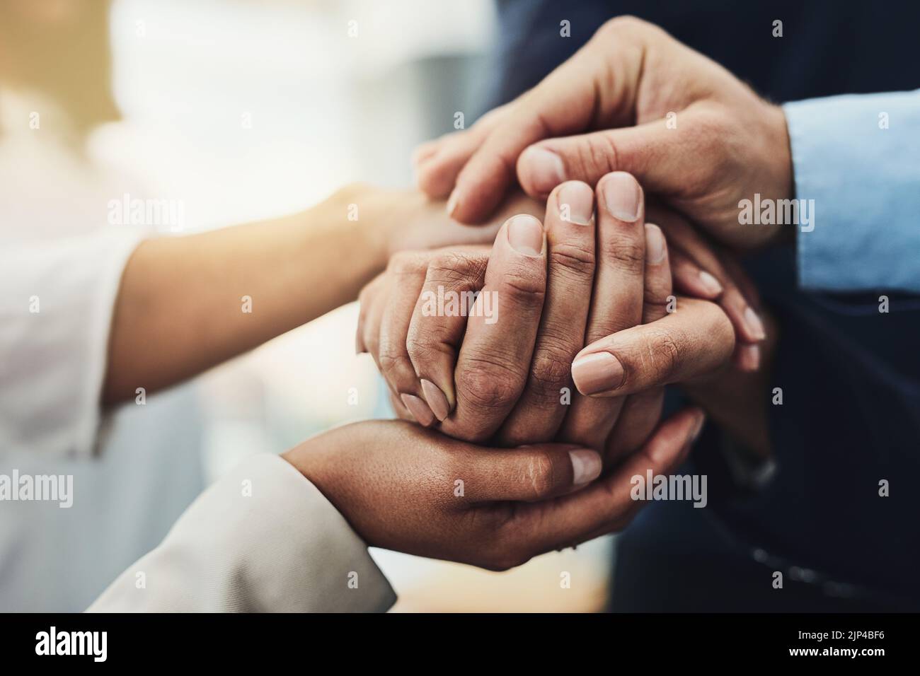 Hand holding showing support, love and care. Close up of a group of ...