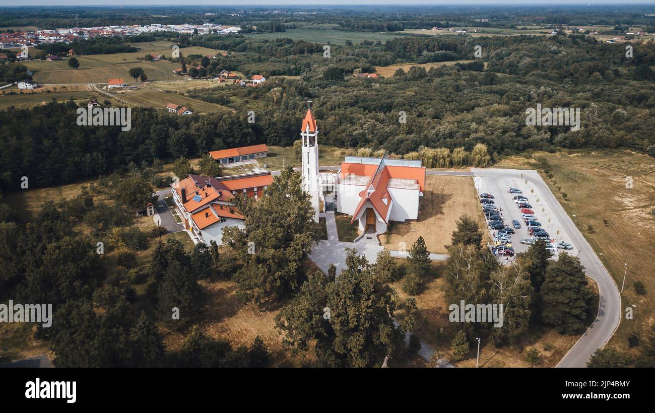 An aerial view of a church surrounded by trees Stock Photo - Alamy