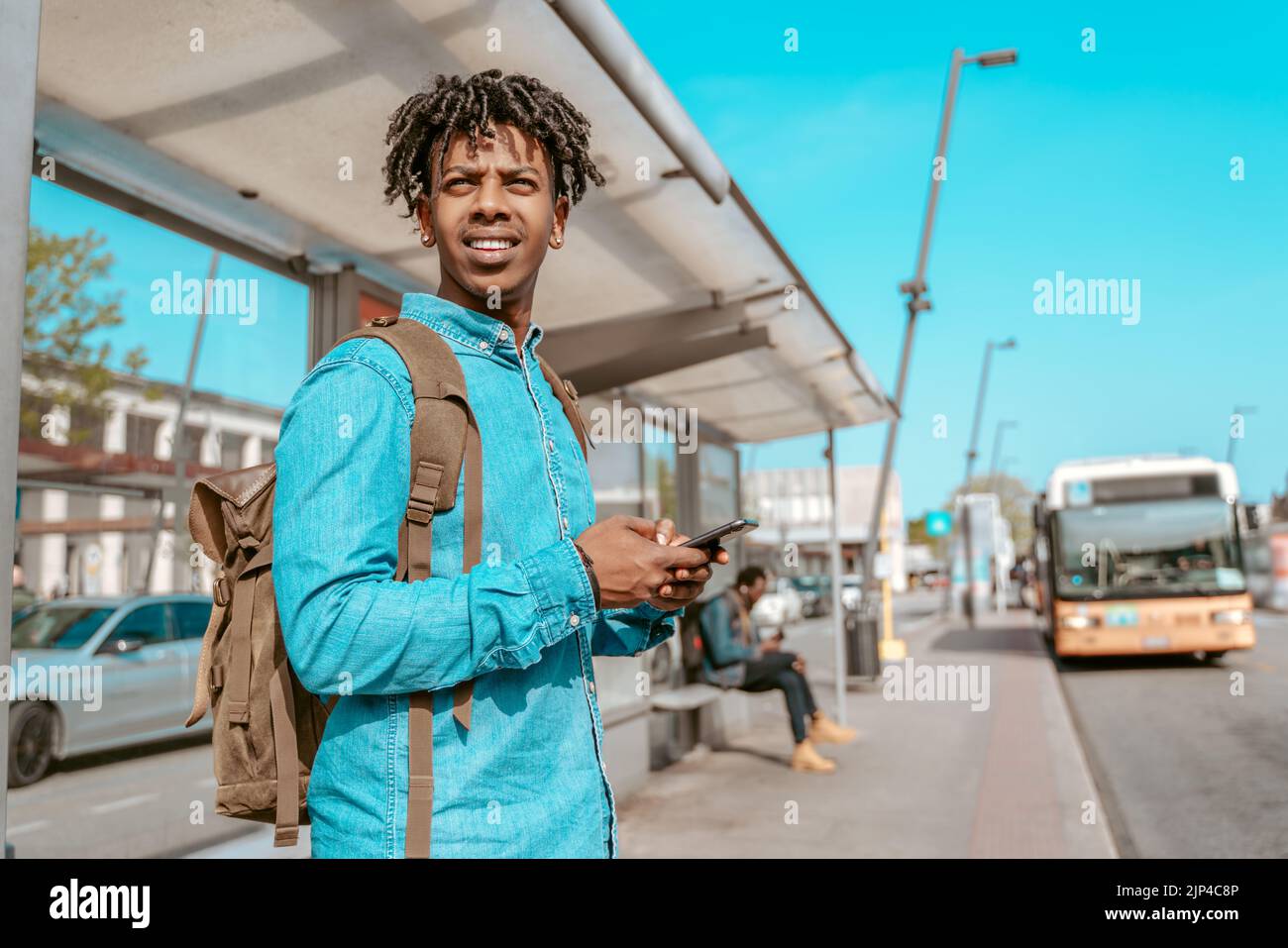 Man standing bus stop hi-res stock photography and images - Alamy